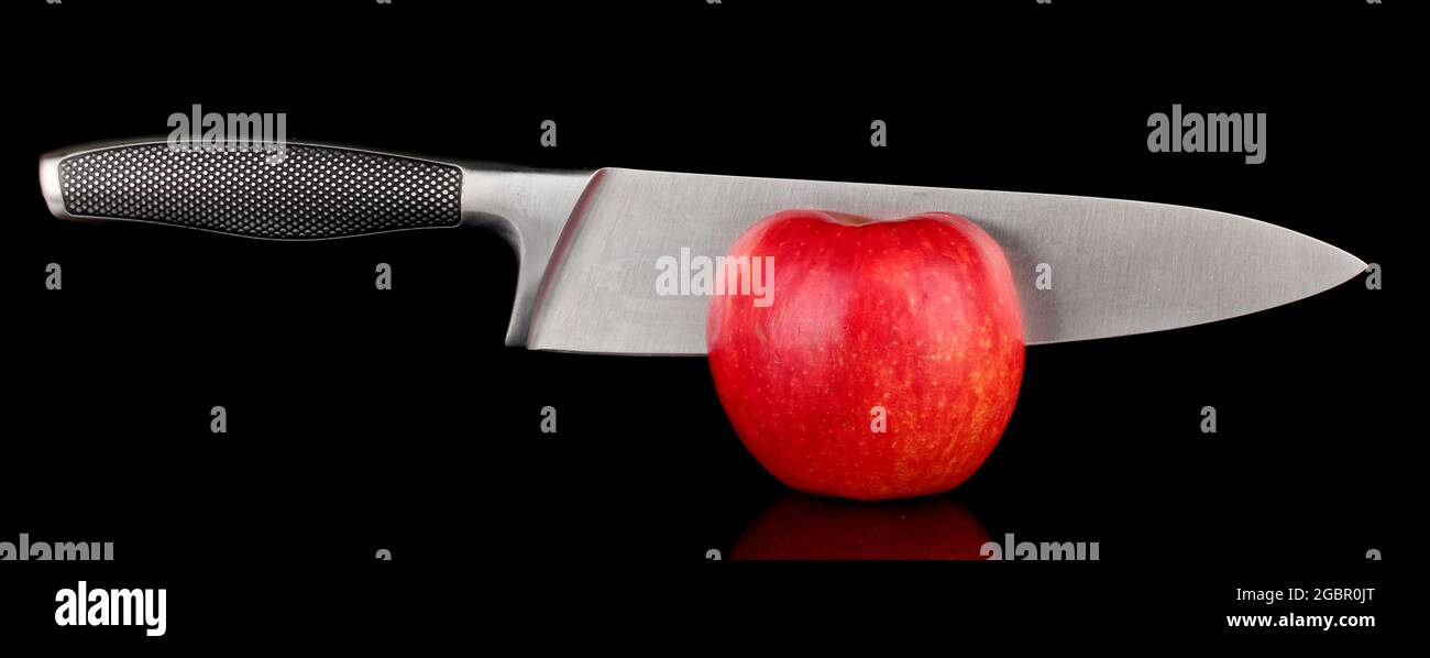 Red apple and knife on isolated on black Stock Photo - Alamy