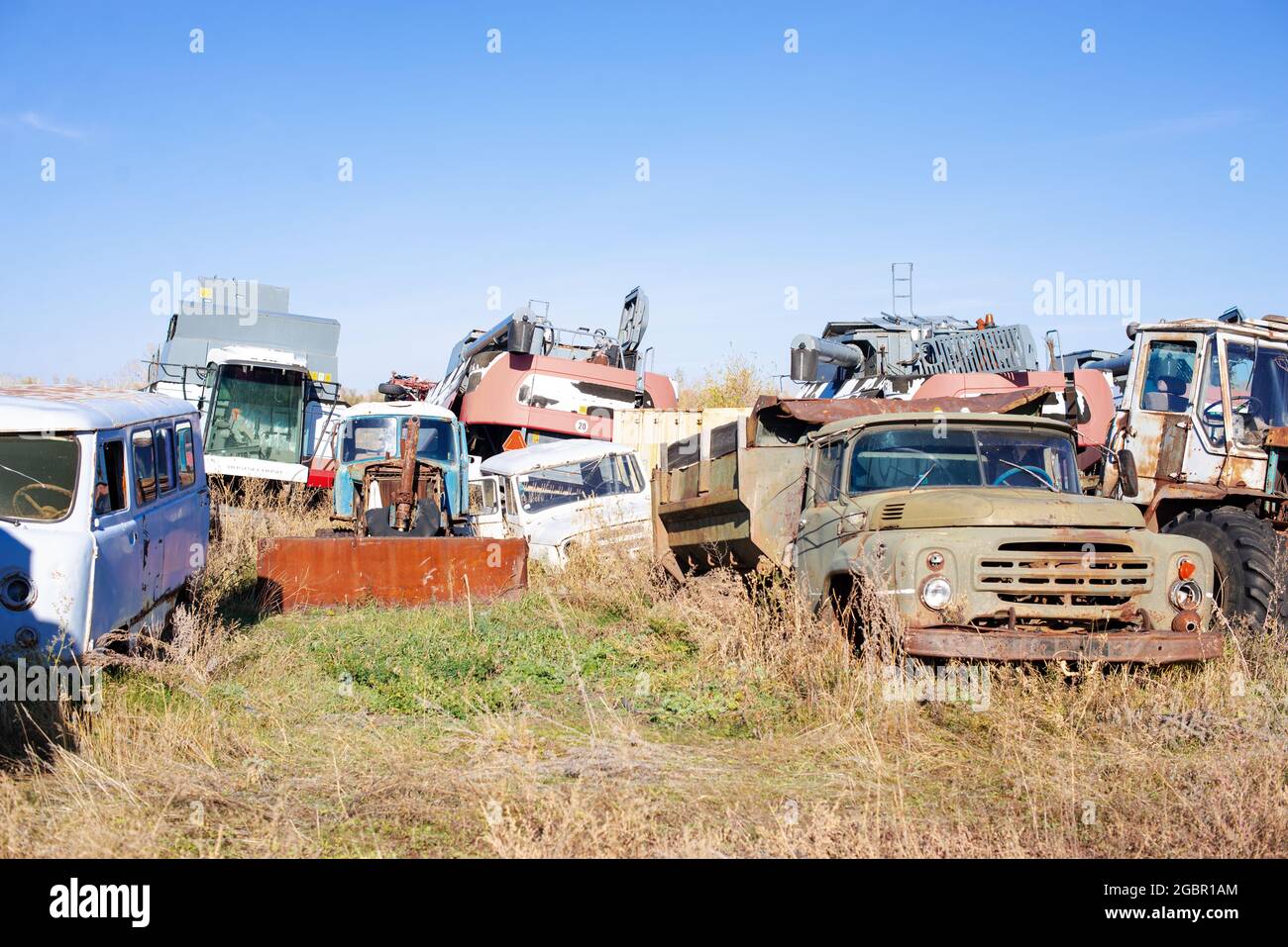 old not working cars. agricultural machinery cemetery Stock Photo - Alamy