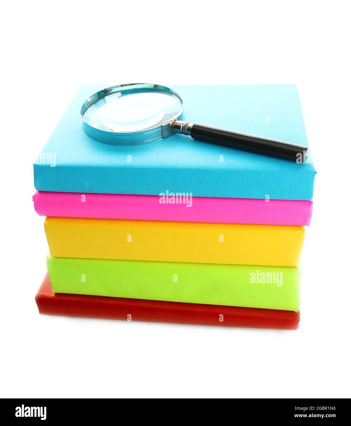 color books with magnifying glass isolated on white Stock Photo - Alamy