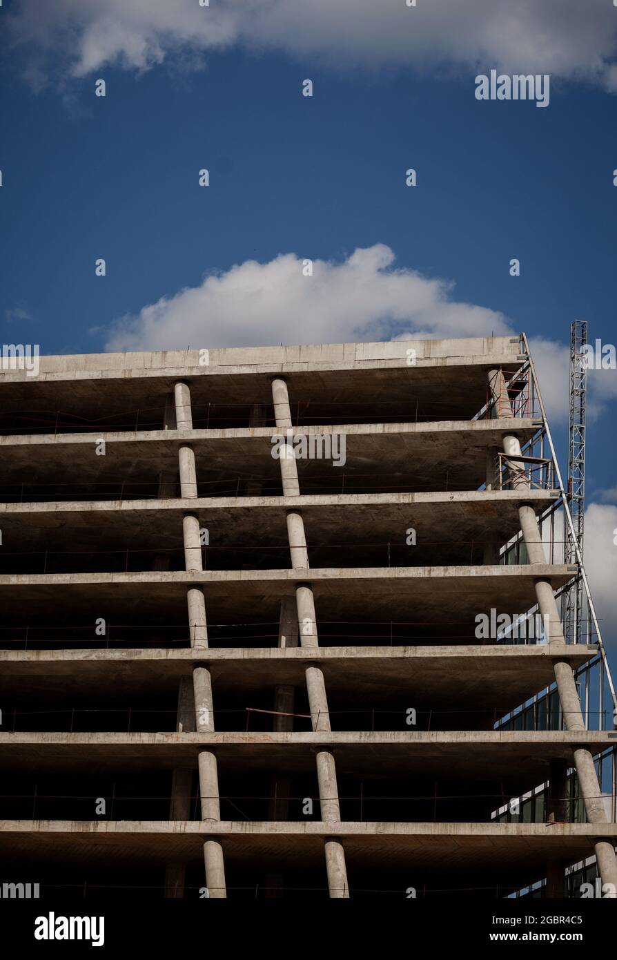 Unfinished concrete building. big construction Stock Photo - Alamy