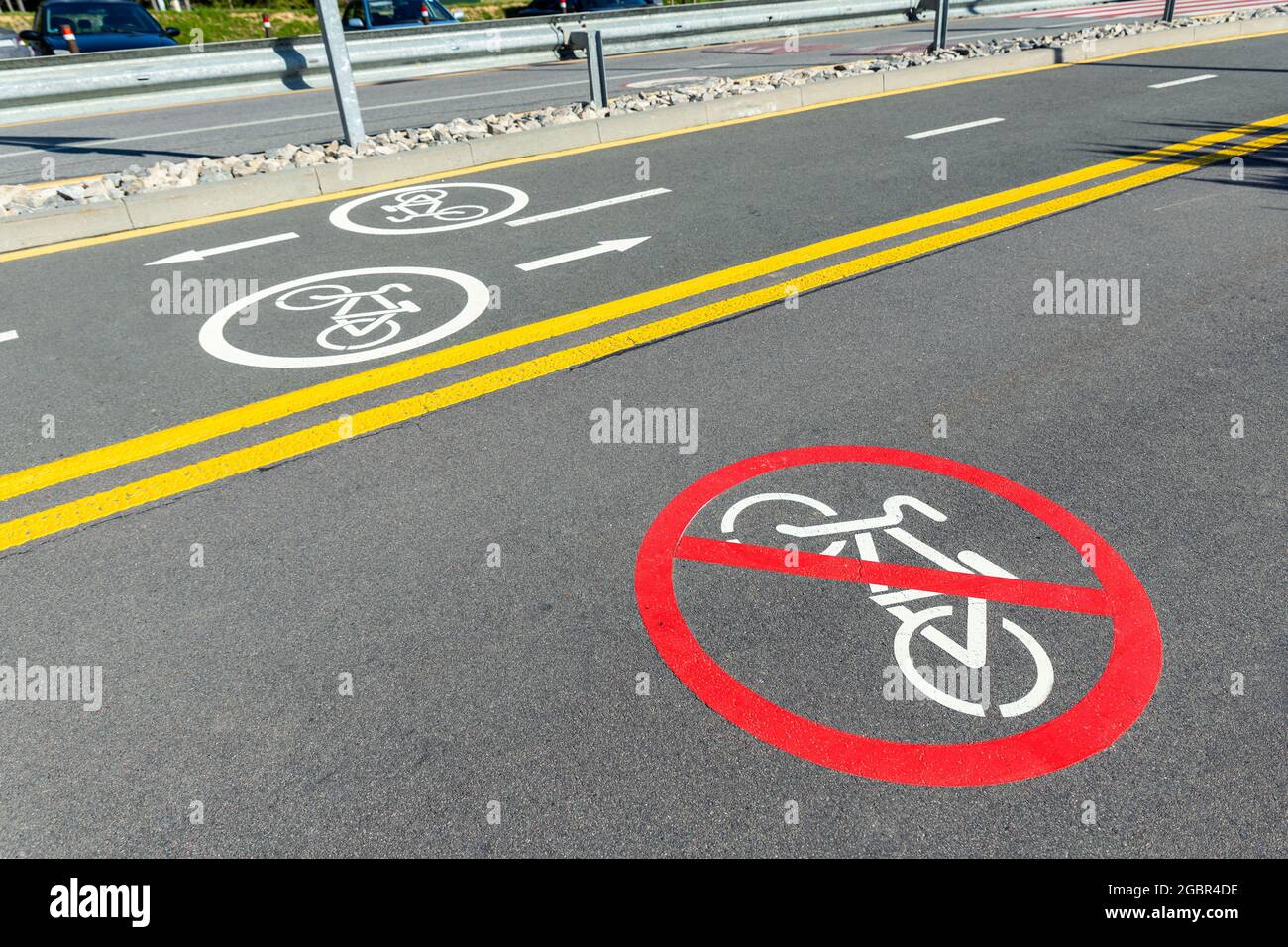 City street asphalt road with separated two way direction bicycle lane ...