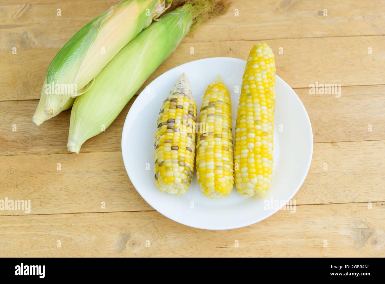 Closeup to white boiled corn Stock Photo - Alamy