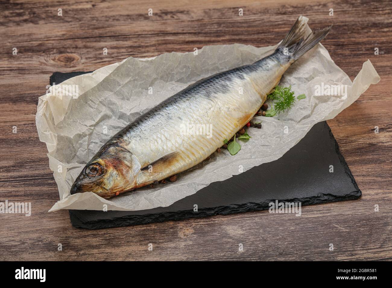 Salted Herring fish with pepper and spices Stock Photo - Alamy