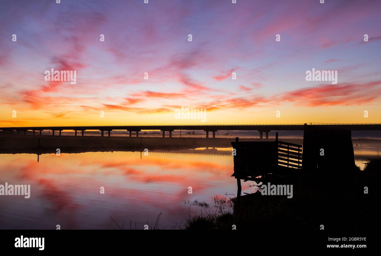 Clear and still morning sunrise sky over a reflection pond Stock Photo ...