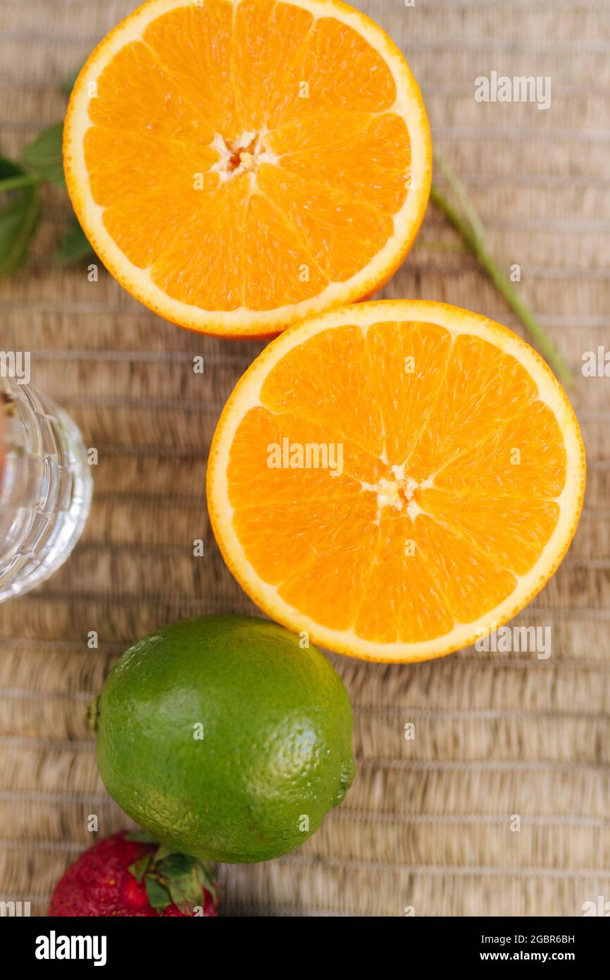 Close up of sliced orange on the table outdoors Stock Photo - Alamy