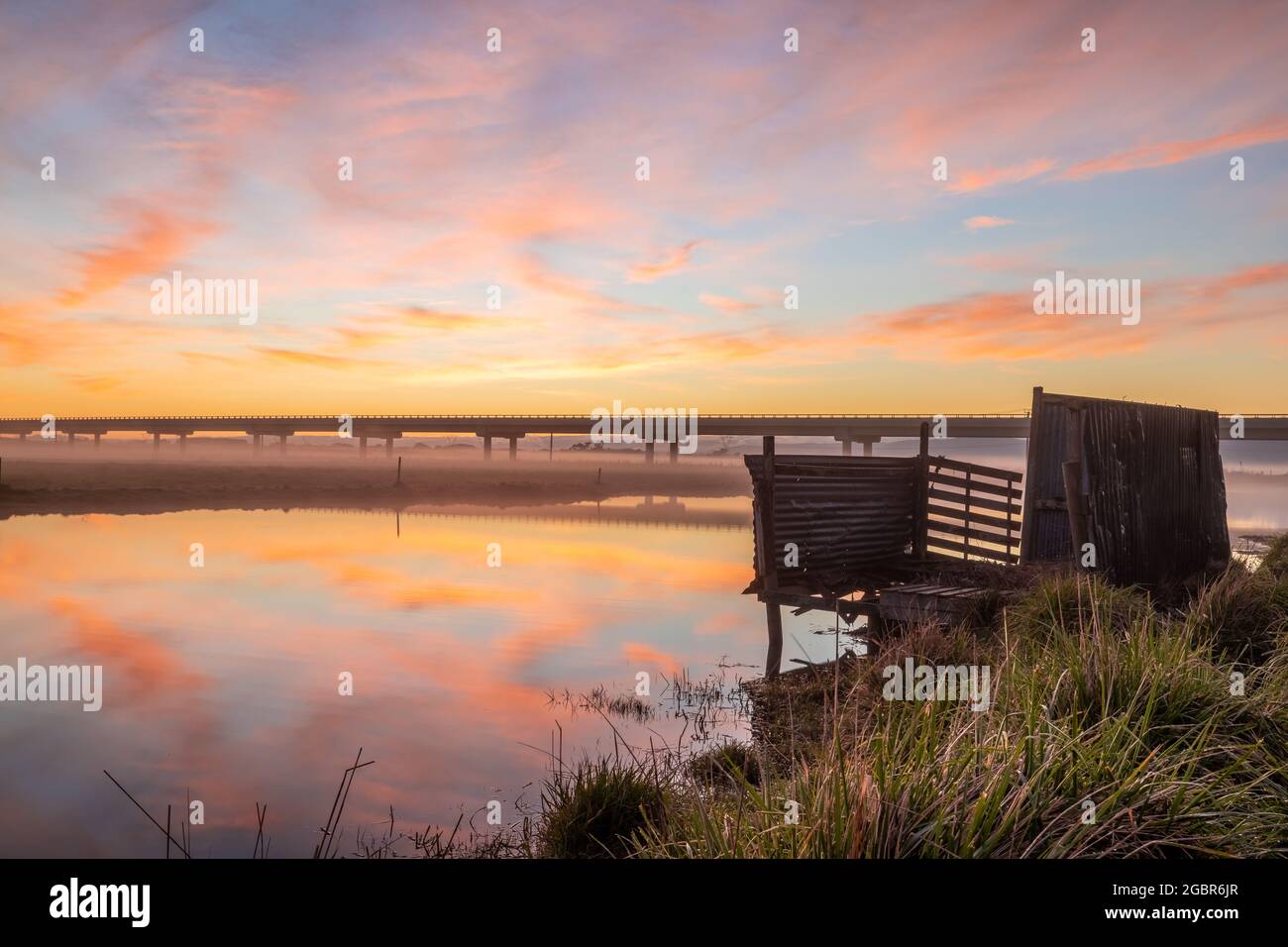 Clear and still morning sunrise sky over a reflection pond Stock Photo ...