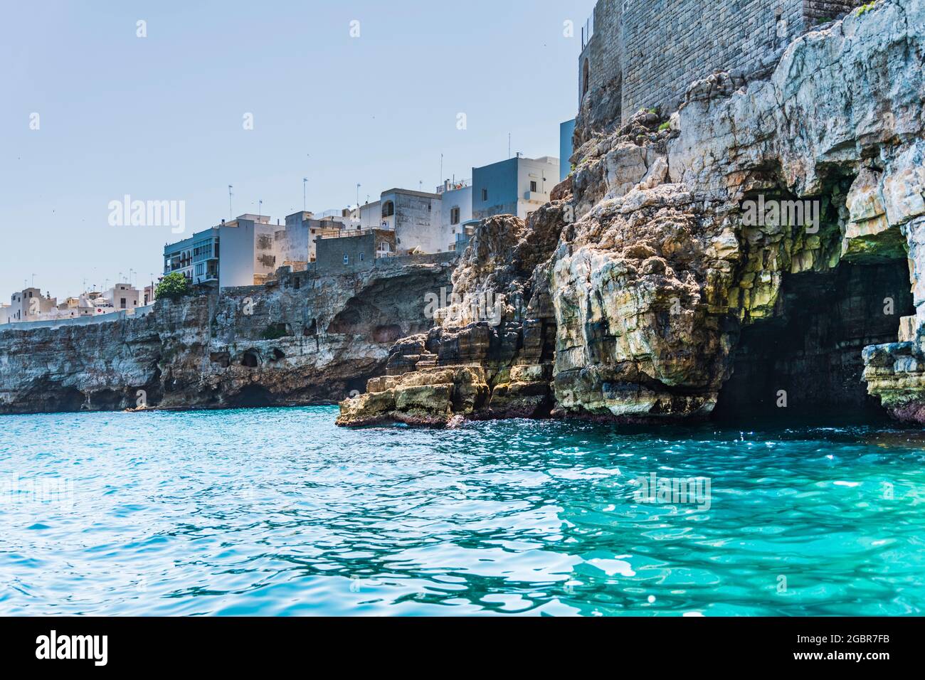 Polignano a Mare seen from the sea. Cliffs and caves Stock Photo - Alamy