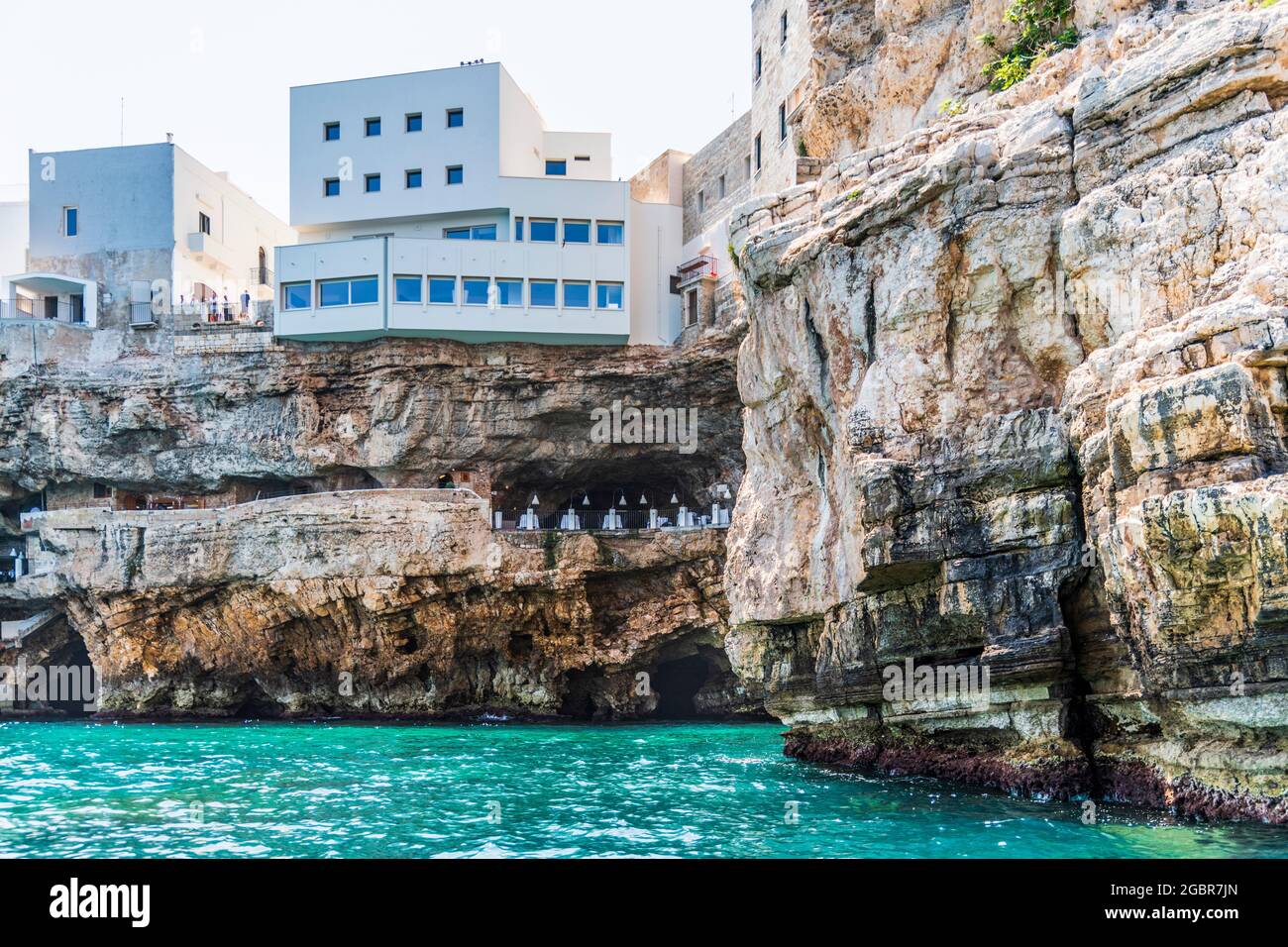 Polignano a Mare seen from the sea. Cliffs and caves Stock Photo - Alamy