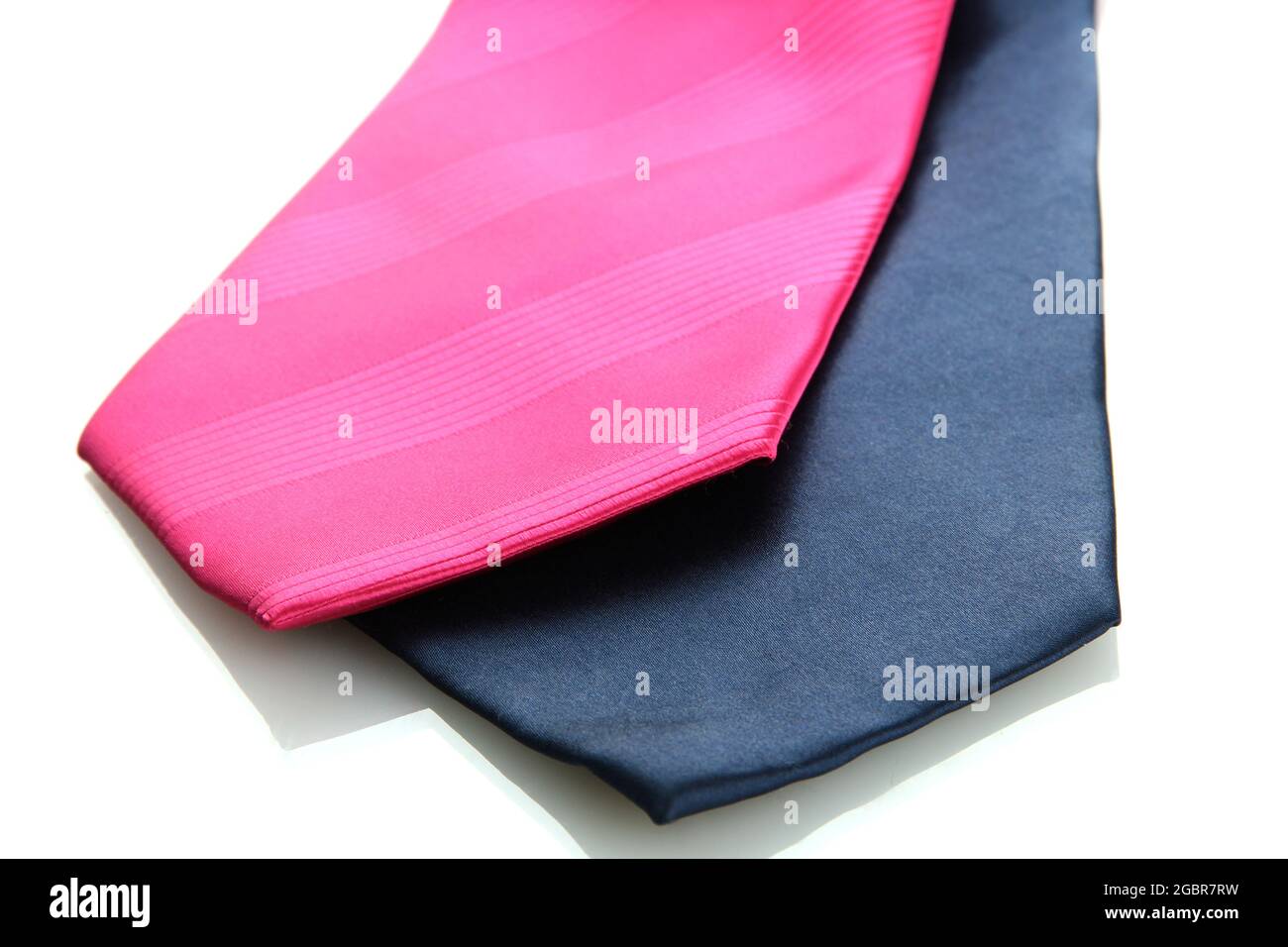 pink and blue ties isolated on white Stock Photo - Alamy