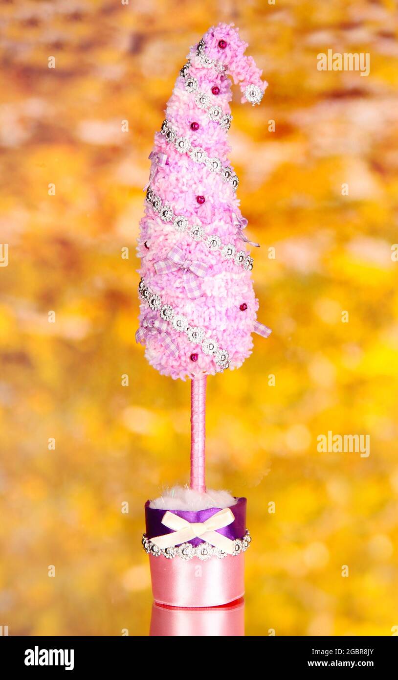 Christmas tree with curved tip on bright background Stock Photo - Alamy