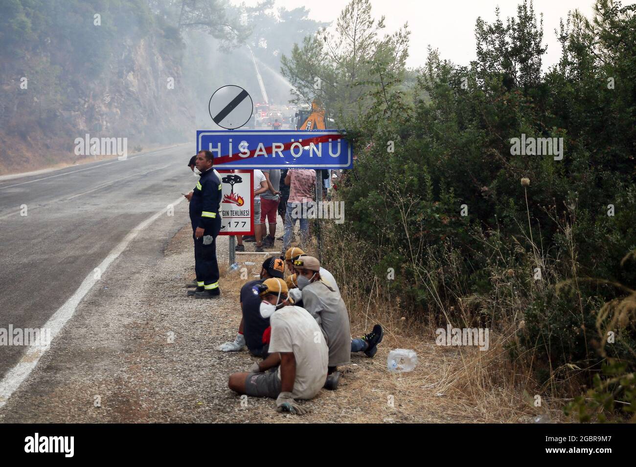 Fire fighters work to stop forest fires near villages at Marmaris ...