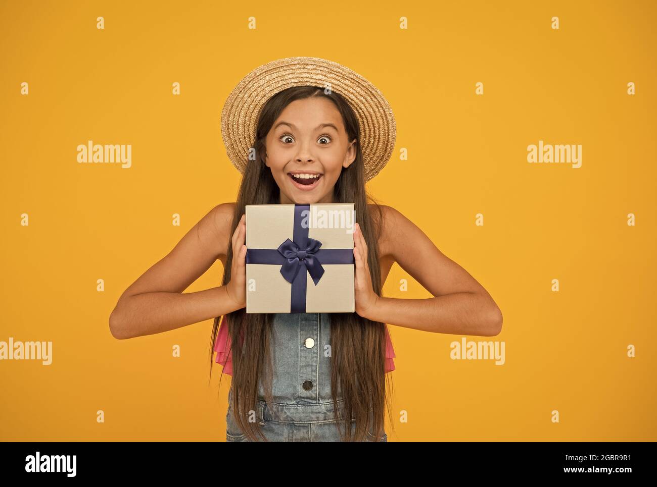 Its time for surprise. Happy girl hold gift yellow background. Surprise ...