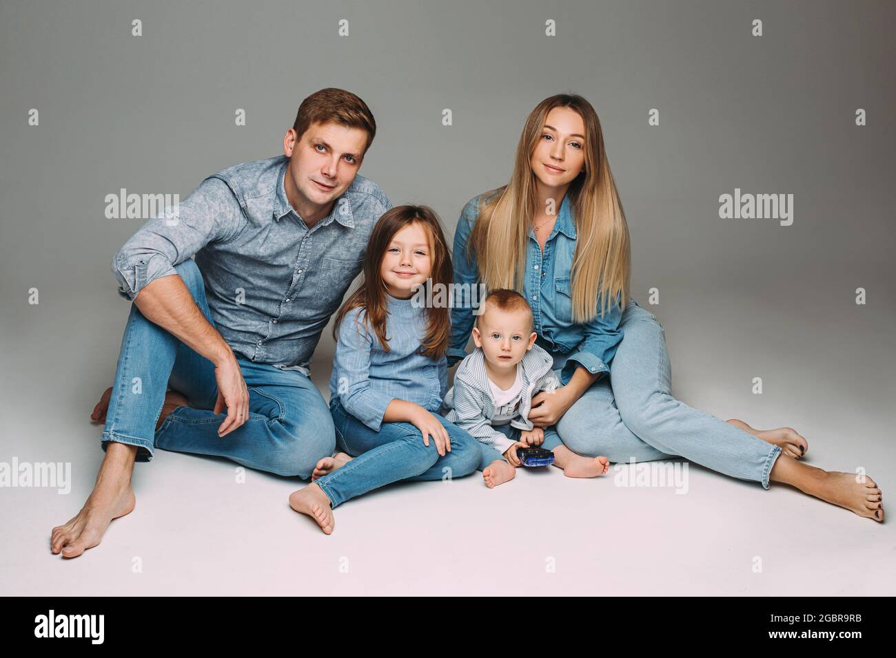 Beautiful Caucasian family with two children Stock Photo - Alamy