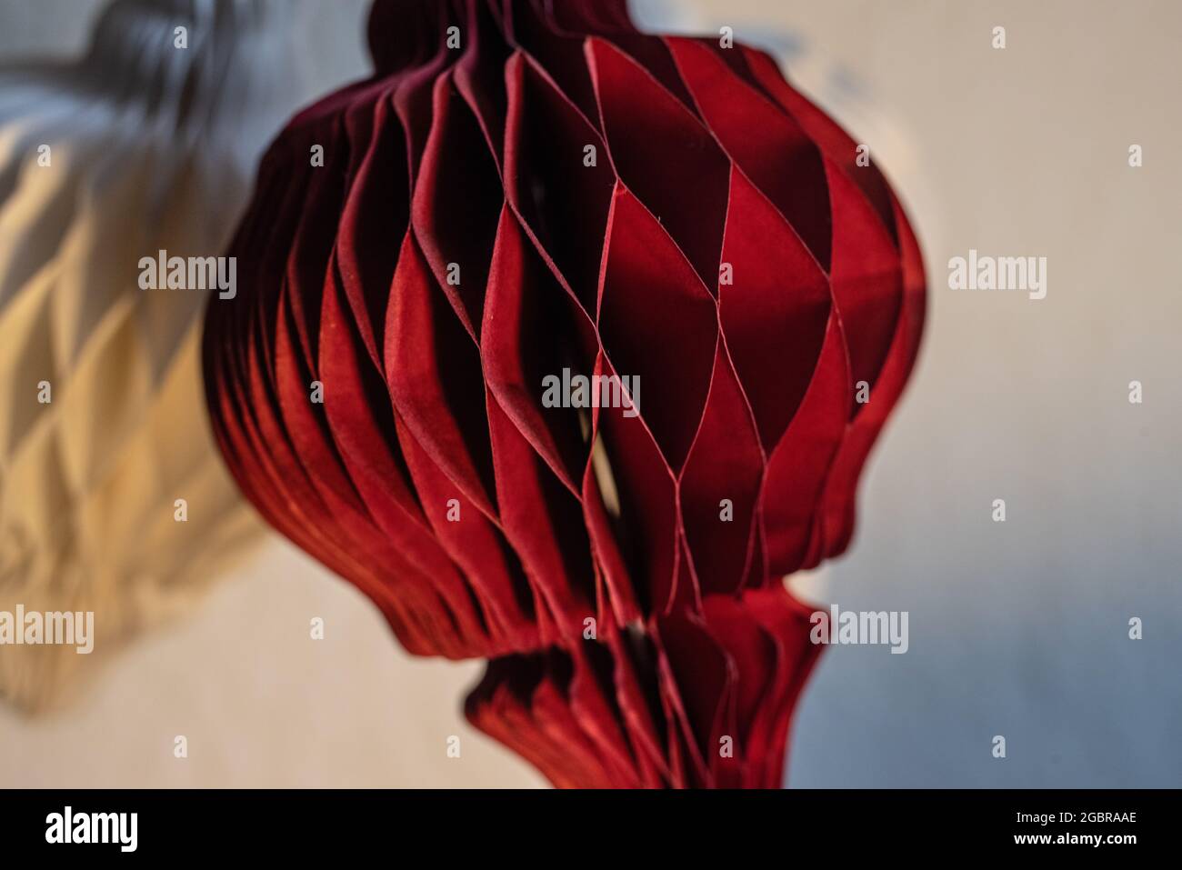 Closeup shot of red origami paper honeycomb ball Stock Photo - Alamy