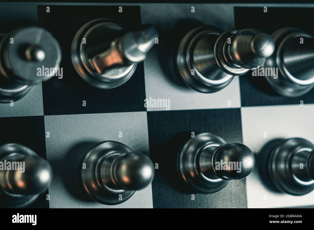 Closeup of metallic chess figures on the checkerboard Stock Photo - Alamy