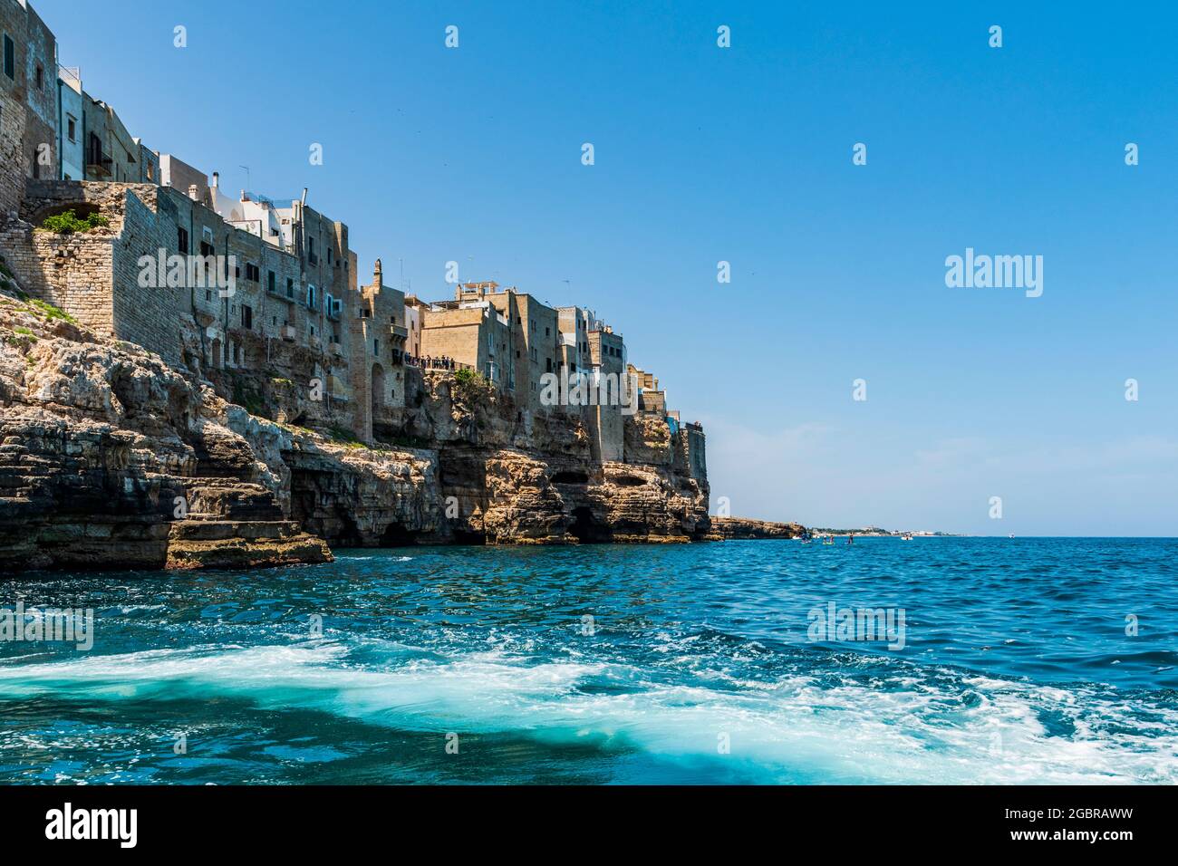 Polignano a Mare seen from the sea. Cliffs and caves Stock Photo - Alamy