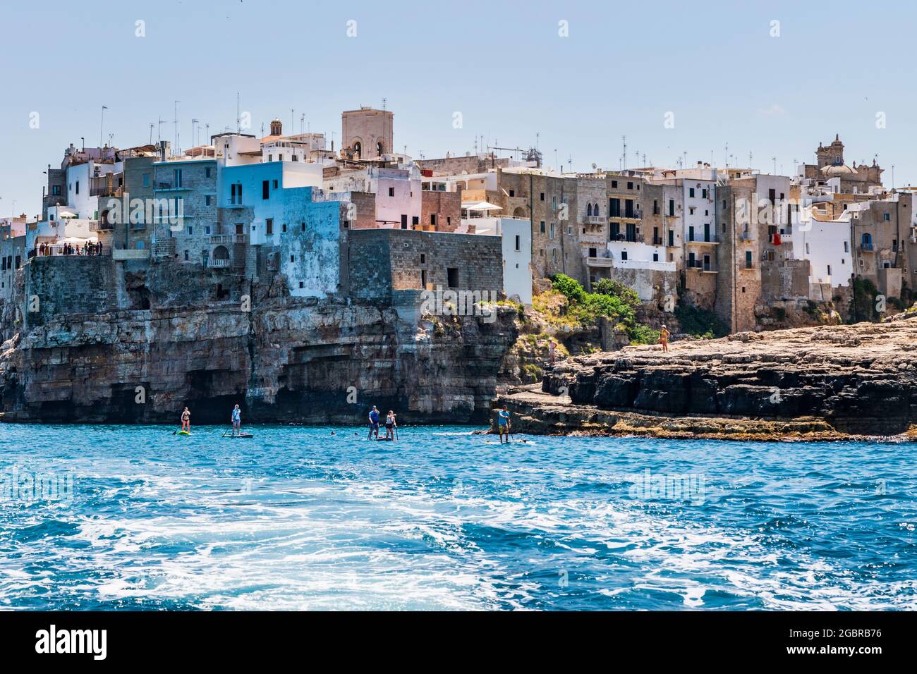 Polignano a Mare seen from the sea. Cliffs and caves Stock Photo - Alamy