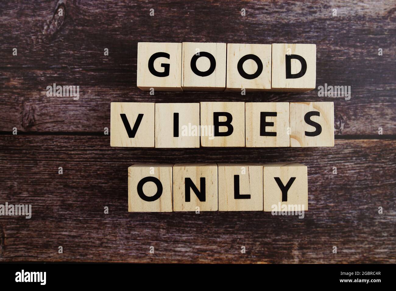 Good Vies Only alphabet letters on wooden background Stock Photo - Alamy