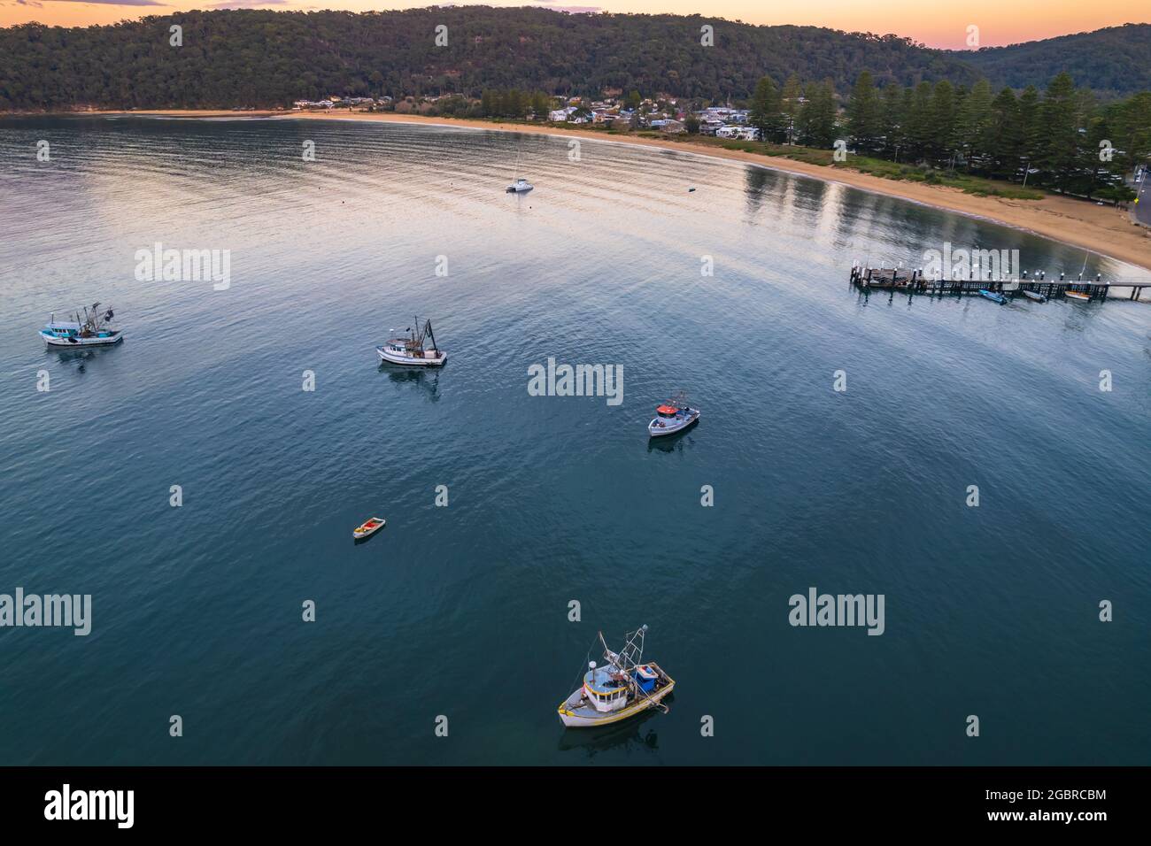 Fishing Boats and sunrise in Brisk Bay from Patonga Beach on the ...