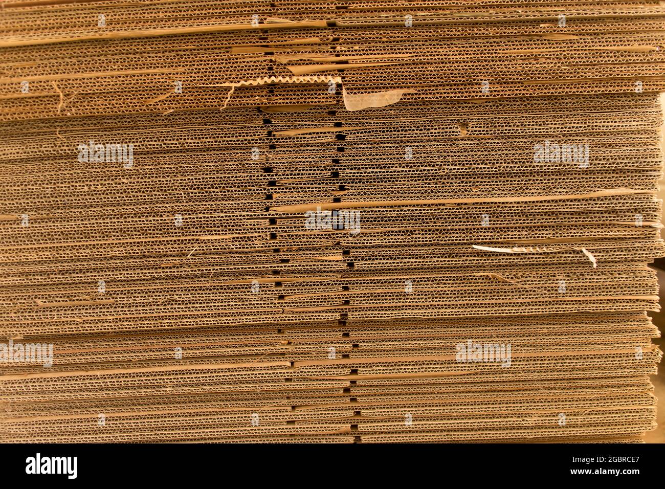 Stack of flattened corrugated cardboard cartons (packing boxes) used ...