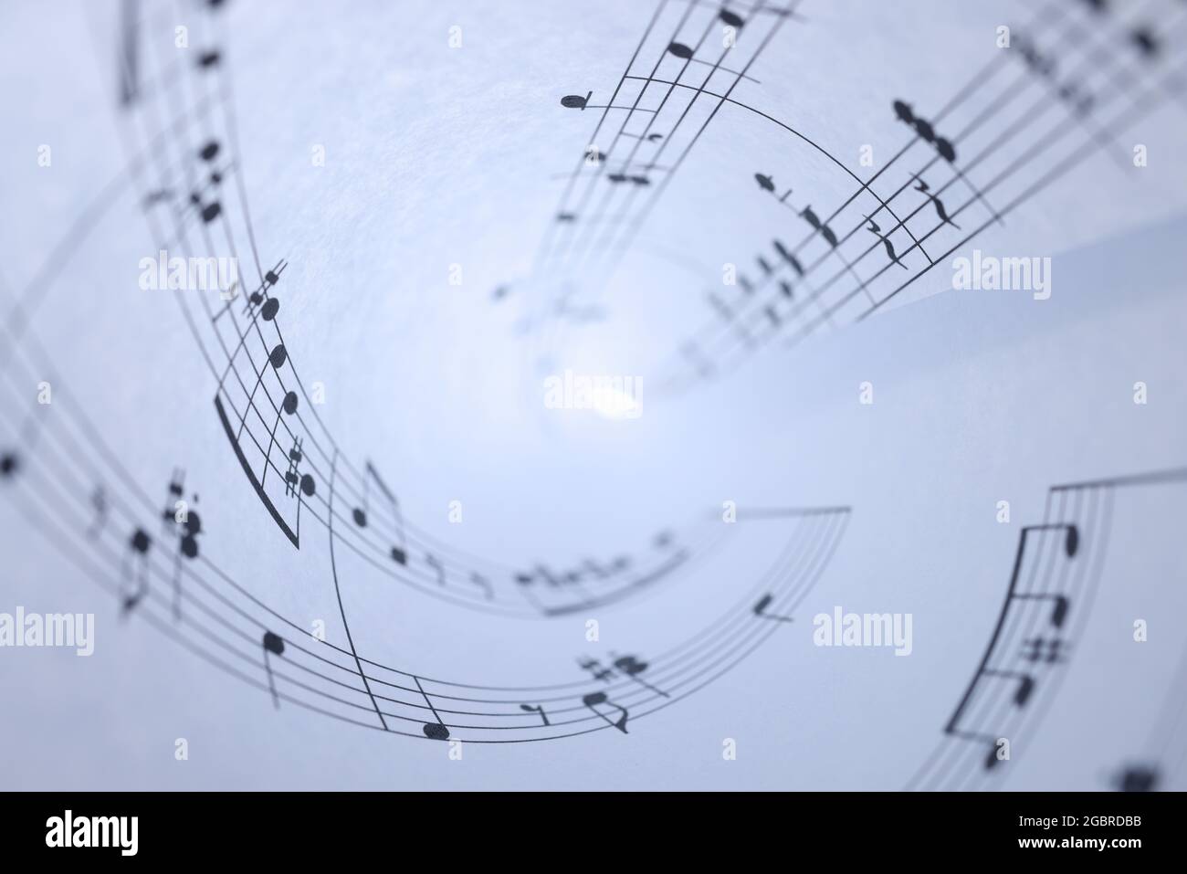 White paper with musical notes rolled up closeup background Stock Photo ...