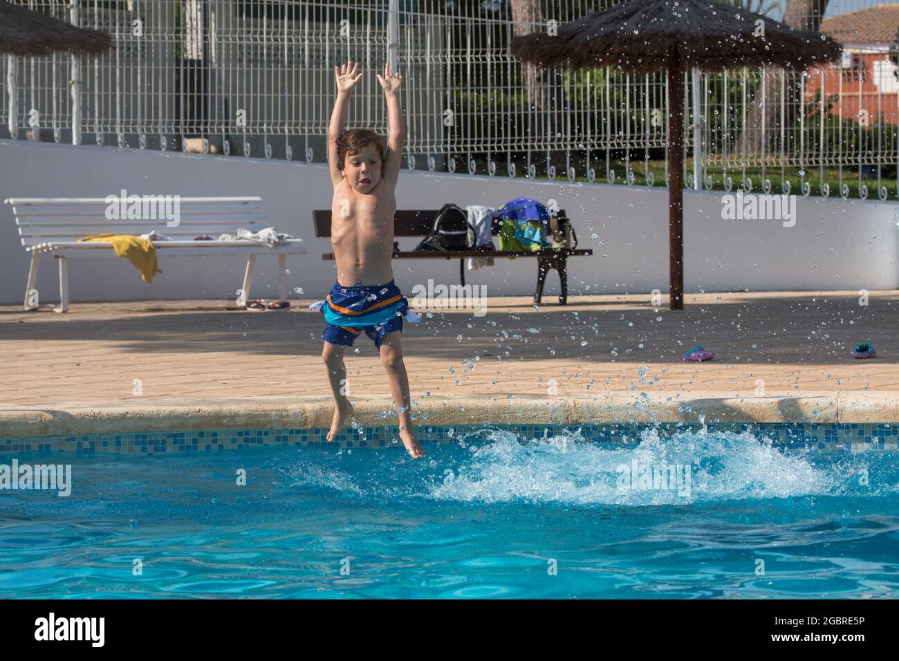 Little kid jumping swimming pool hi-res stock photography and images ...