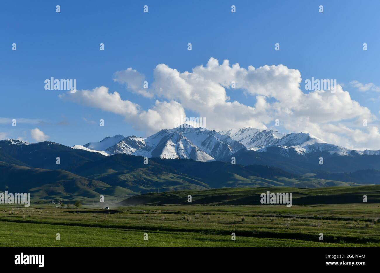 Mountain landscape with clouds and road, Kazakhstan, Almaty region ...