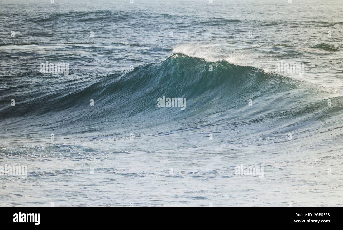 Perfect waves breaking in a beach Stock Photo - Alamy