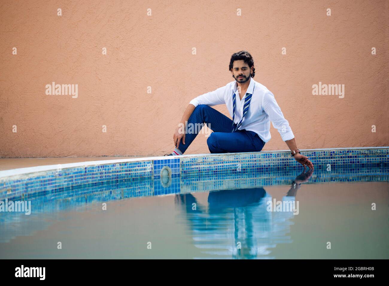 Young male model in garden Stock Photo - Alamy