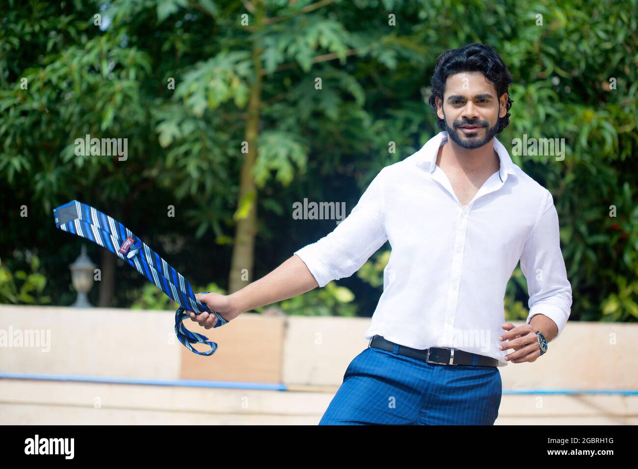 Young male model in garden Stock Photo - Alamy