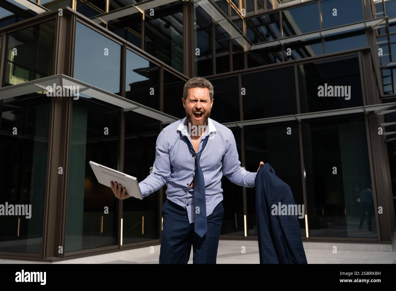 frustrated businessman man shouting in rage with computer and jacket ...
