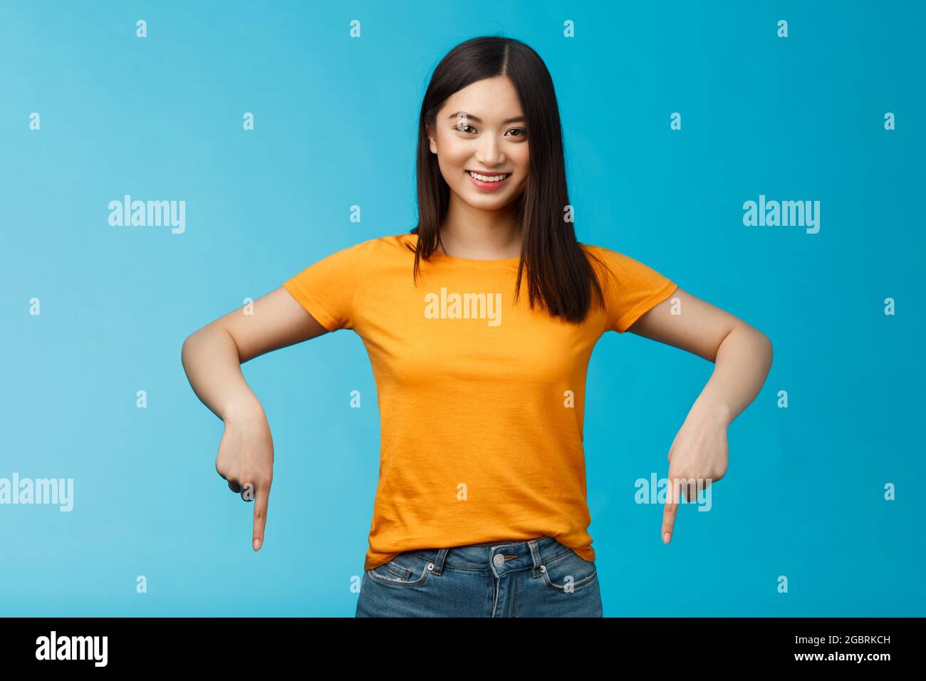 Cheerful self-assured asian girl dark haitcut wear yellow summer t ...