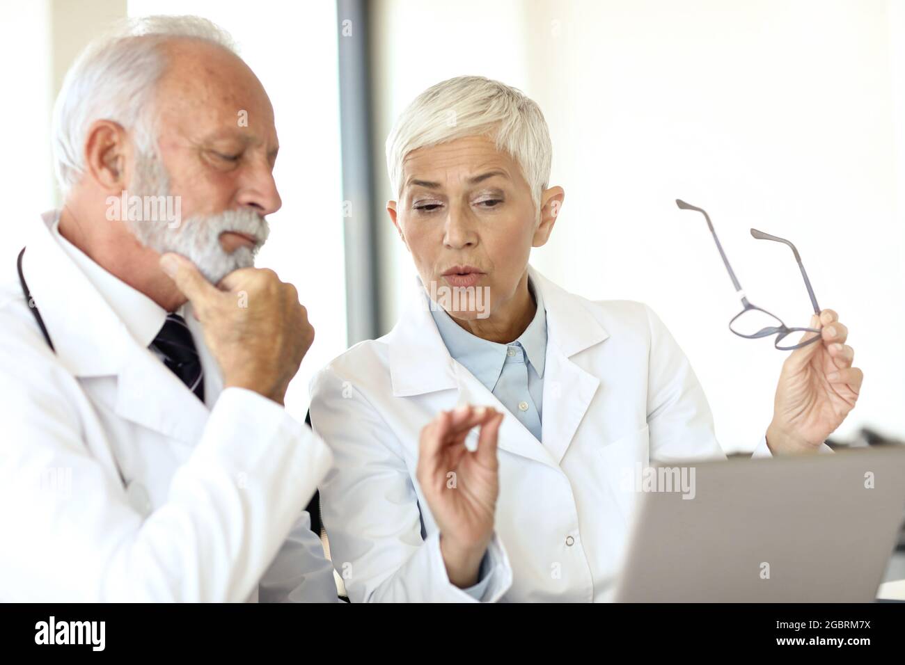 doctor senior man medical woman hospital conversation healthcare ...