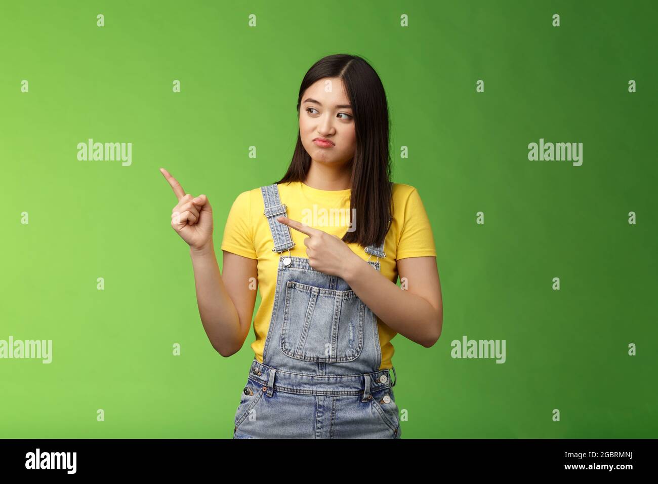 Upset cute asian female student pulling face regret shame, pity missing ...