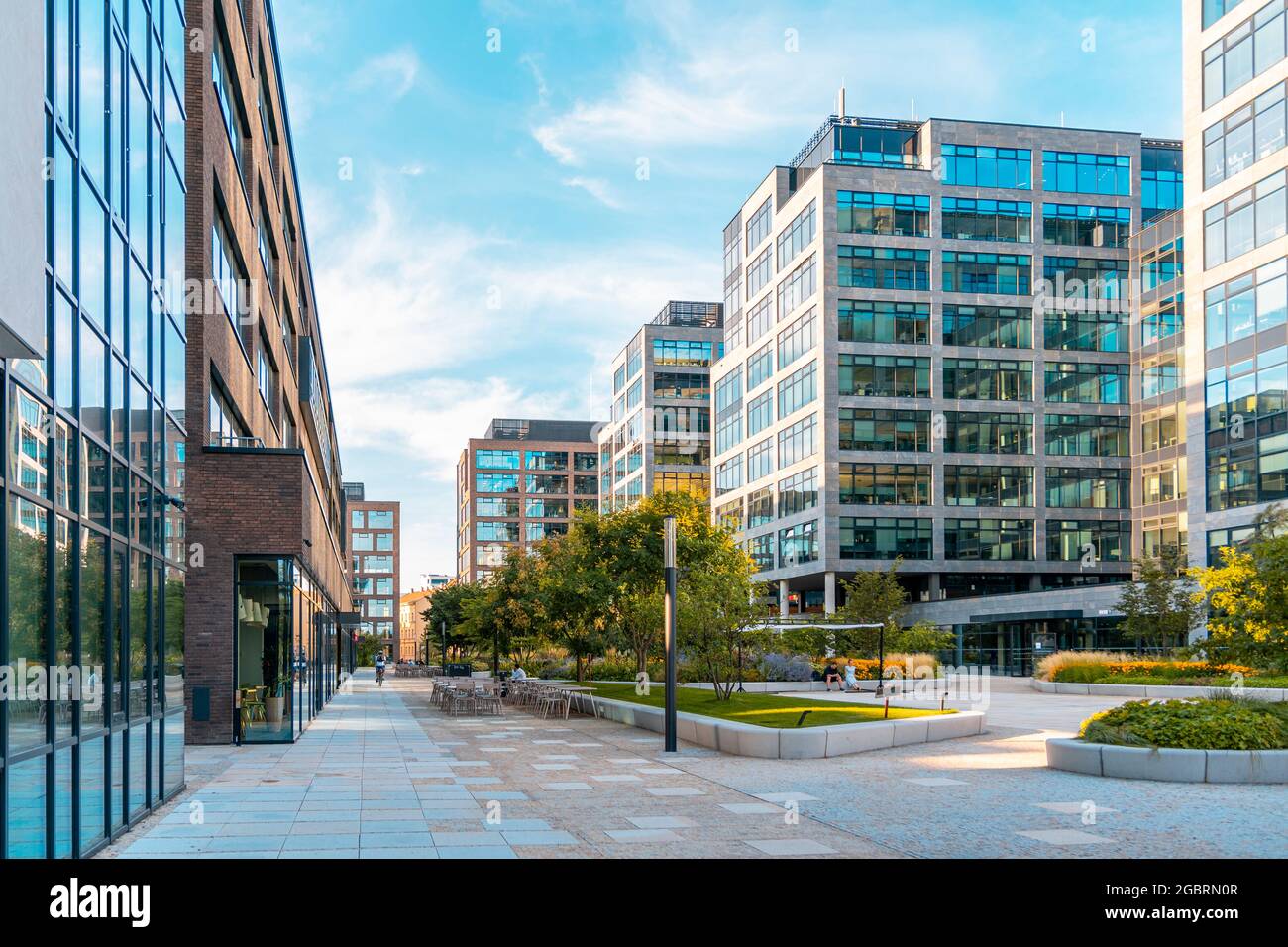 Modern office buildings at sunny day with cafe plants and places to ...