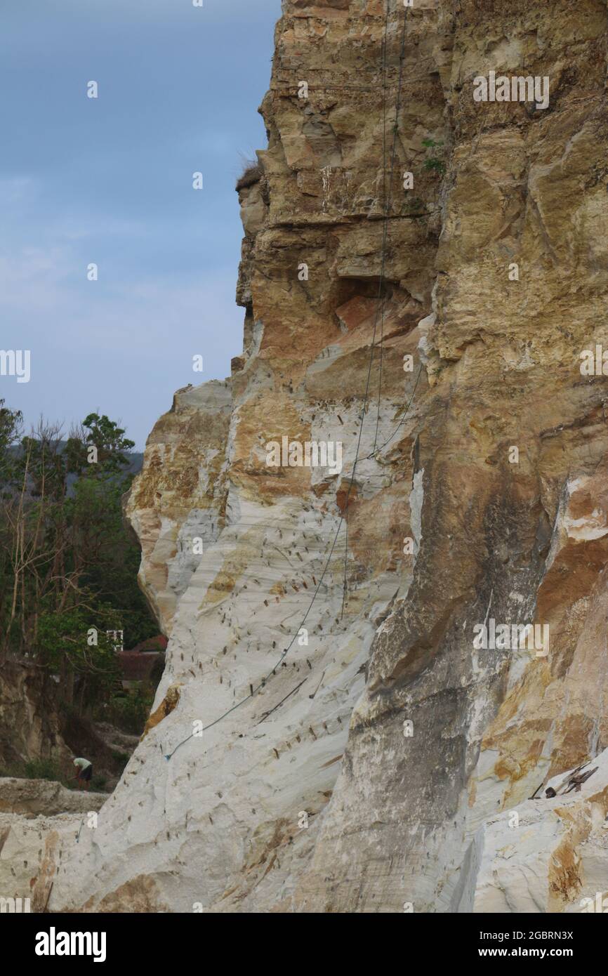 Part view from a light brown scratched rock stone hill in a quarry ...
