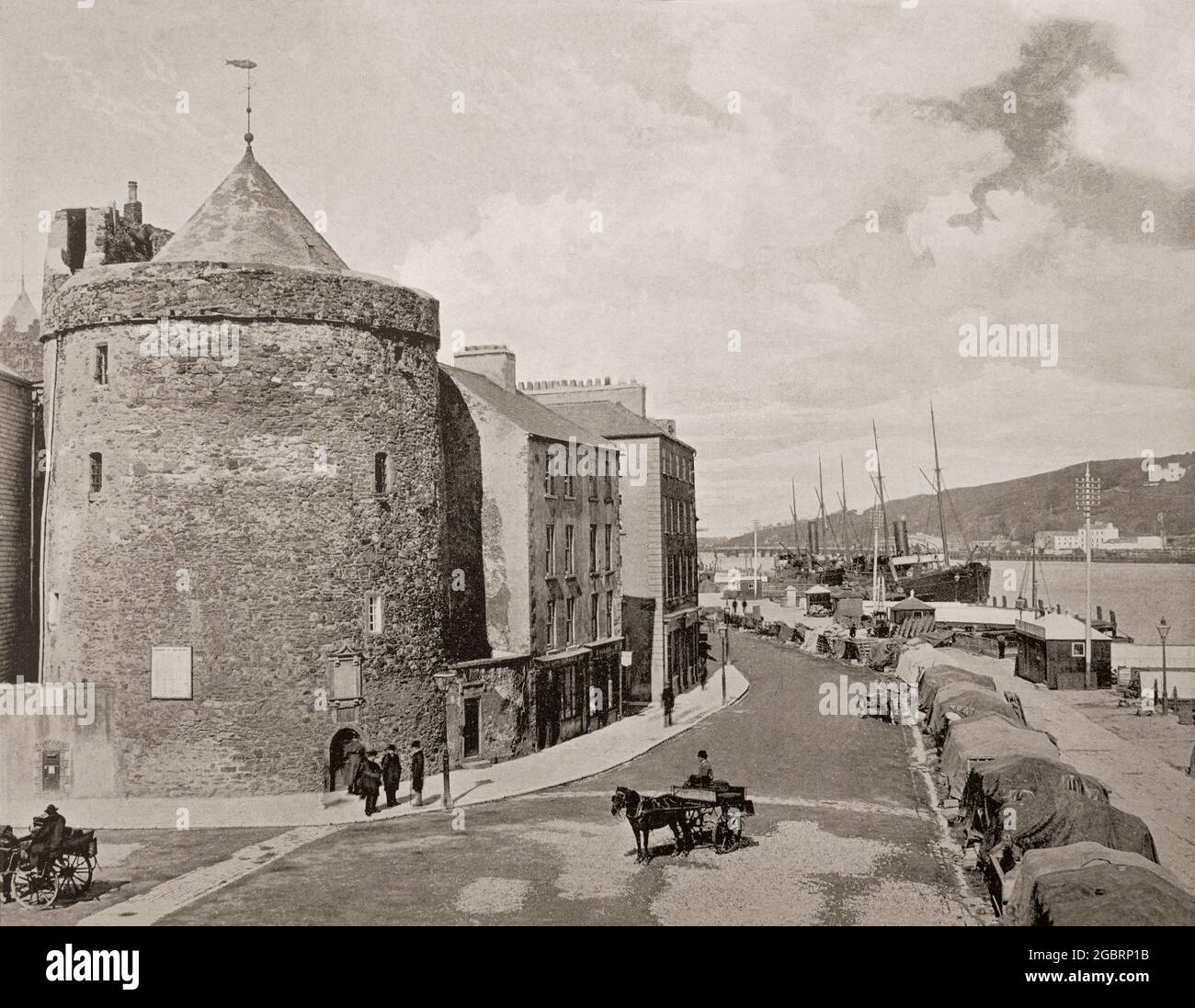 A late 19th century view of the south quays along the River Suir as it ...