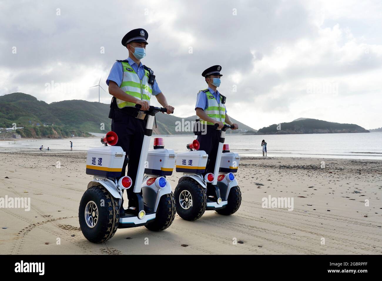 ZHOUSHAN, CHINA - AUGUST 5, 2021 - Police patrol the beach in a Police ...