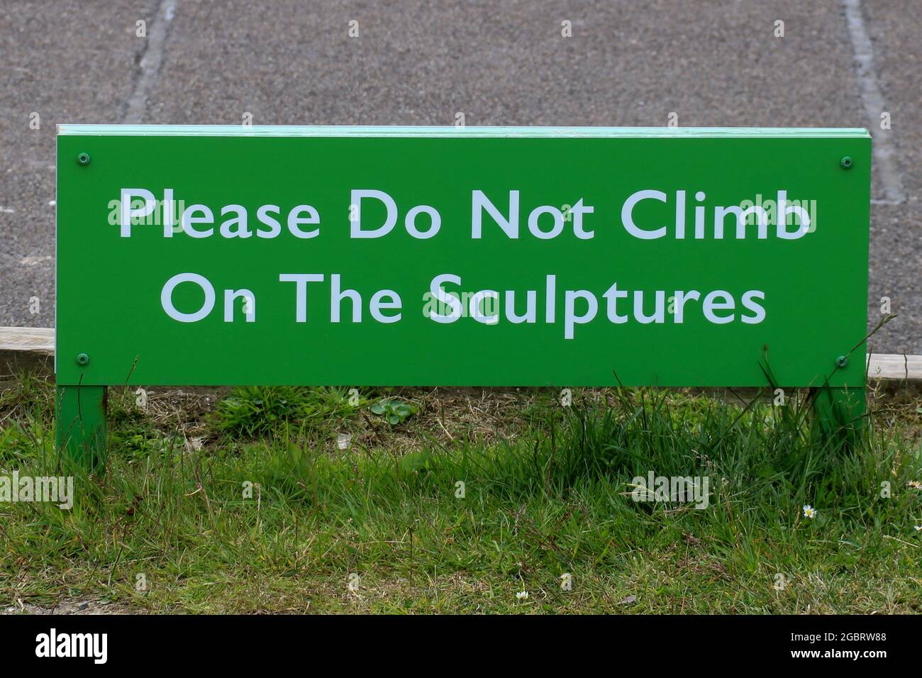 Do not climb on the sculptures sign at a country tourist car park Stock ...