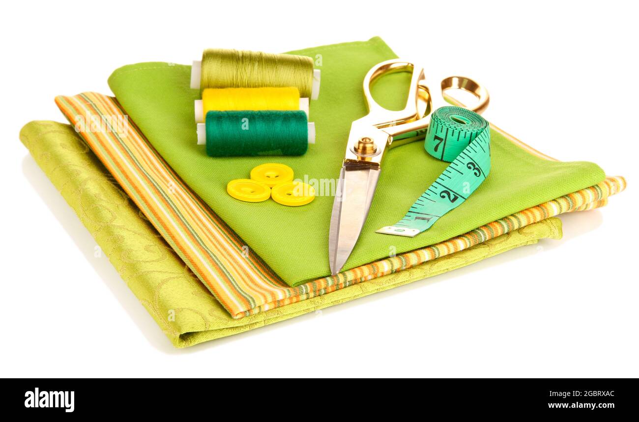 Sewing accessories and fabric isolated on white Stock Photo - Alamy