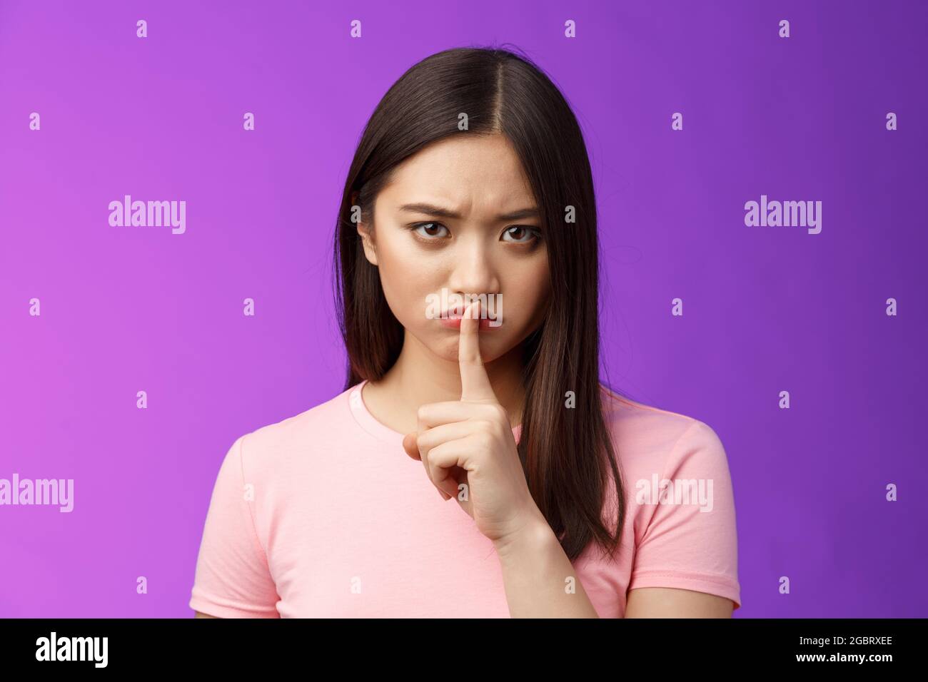 Close-up offended serious-looking upset asian young girl frowning ...