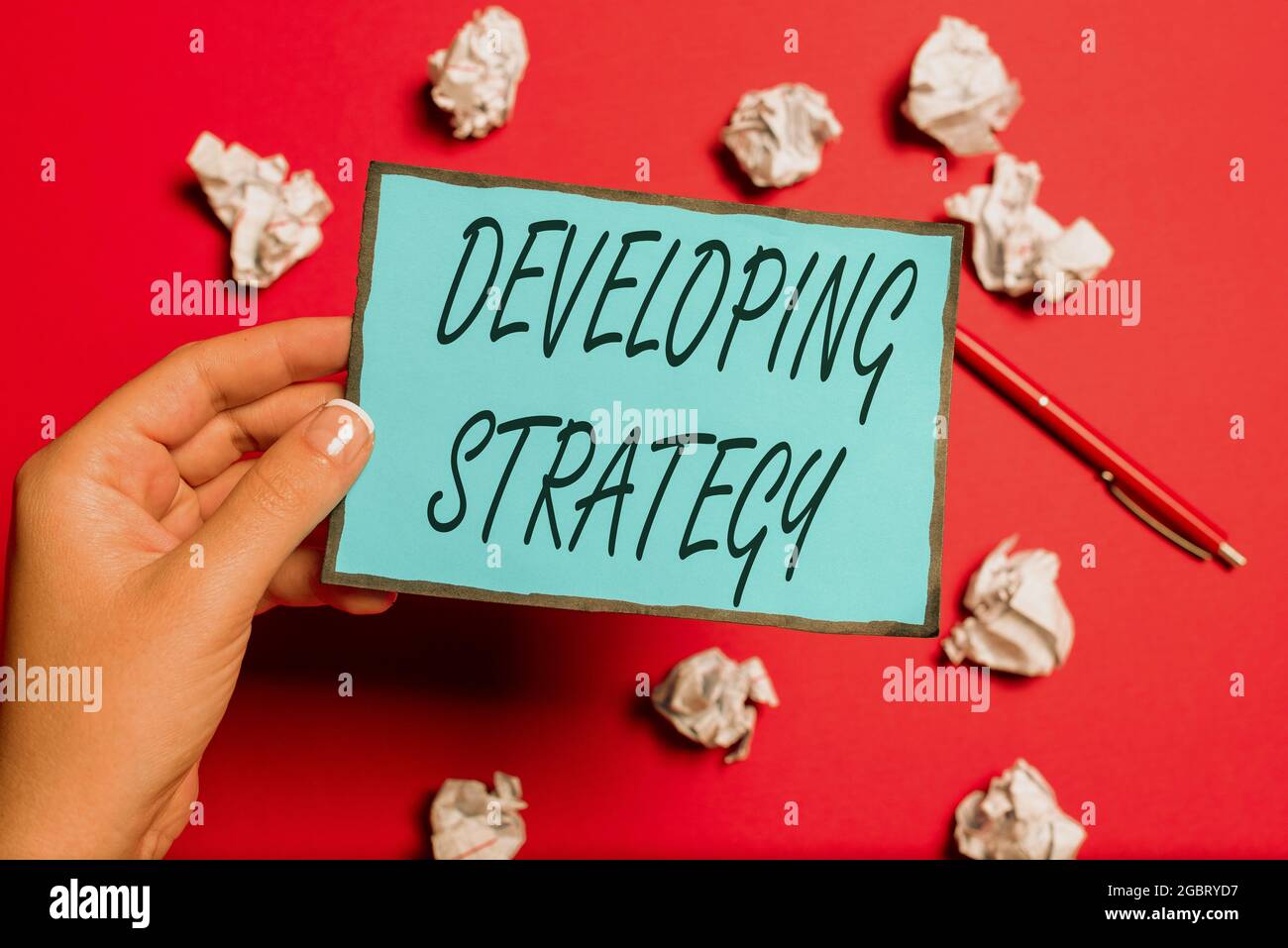 Handwriting text Developing Strategy. Concept meaning Game plan that ...