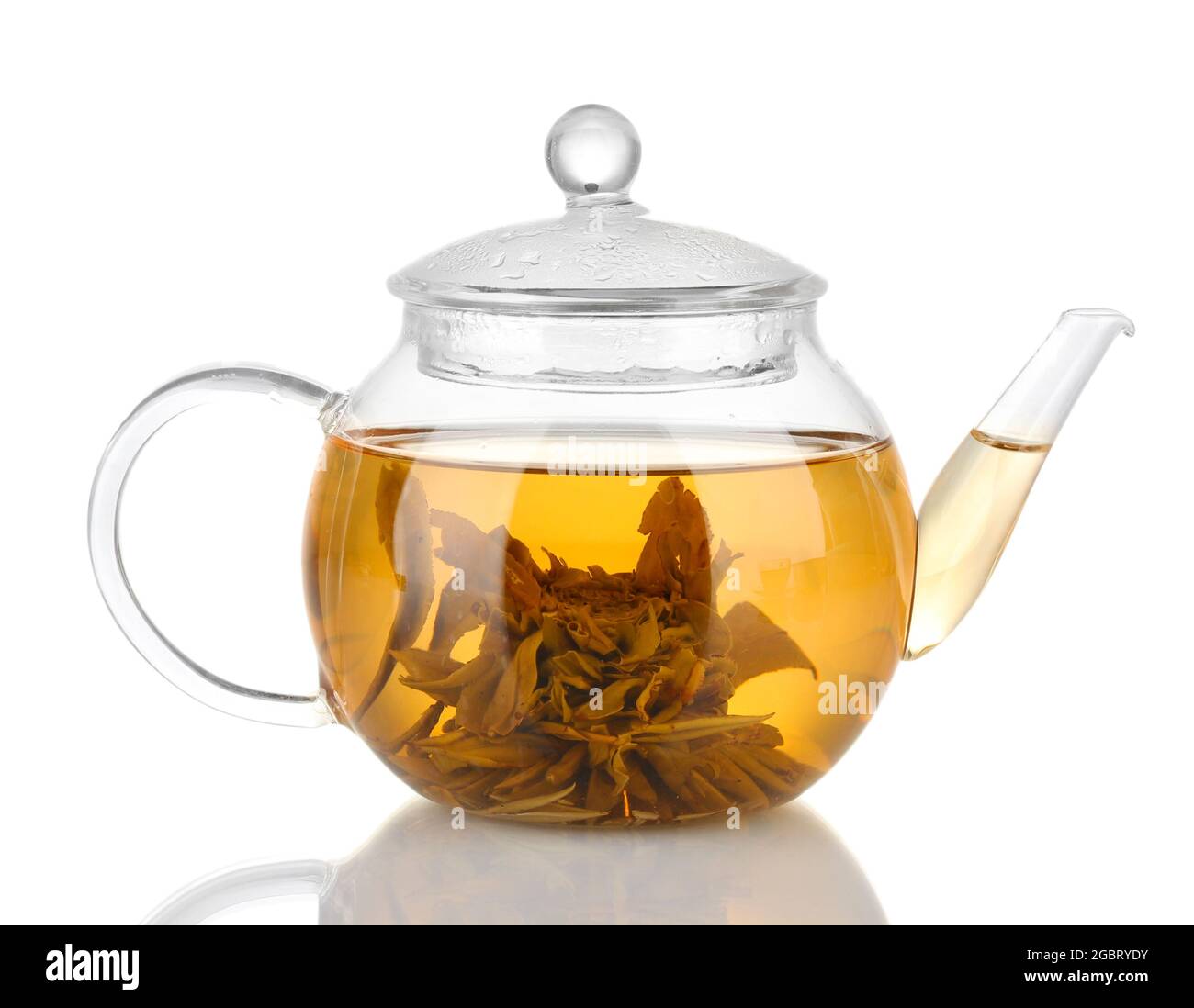 Exotic green tea with flowers in glass teapot isolated on white Stock ...