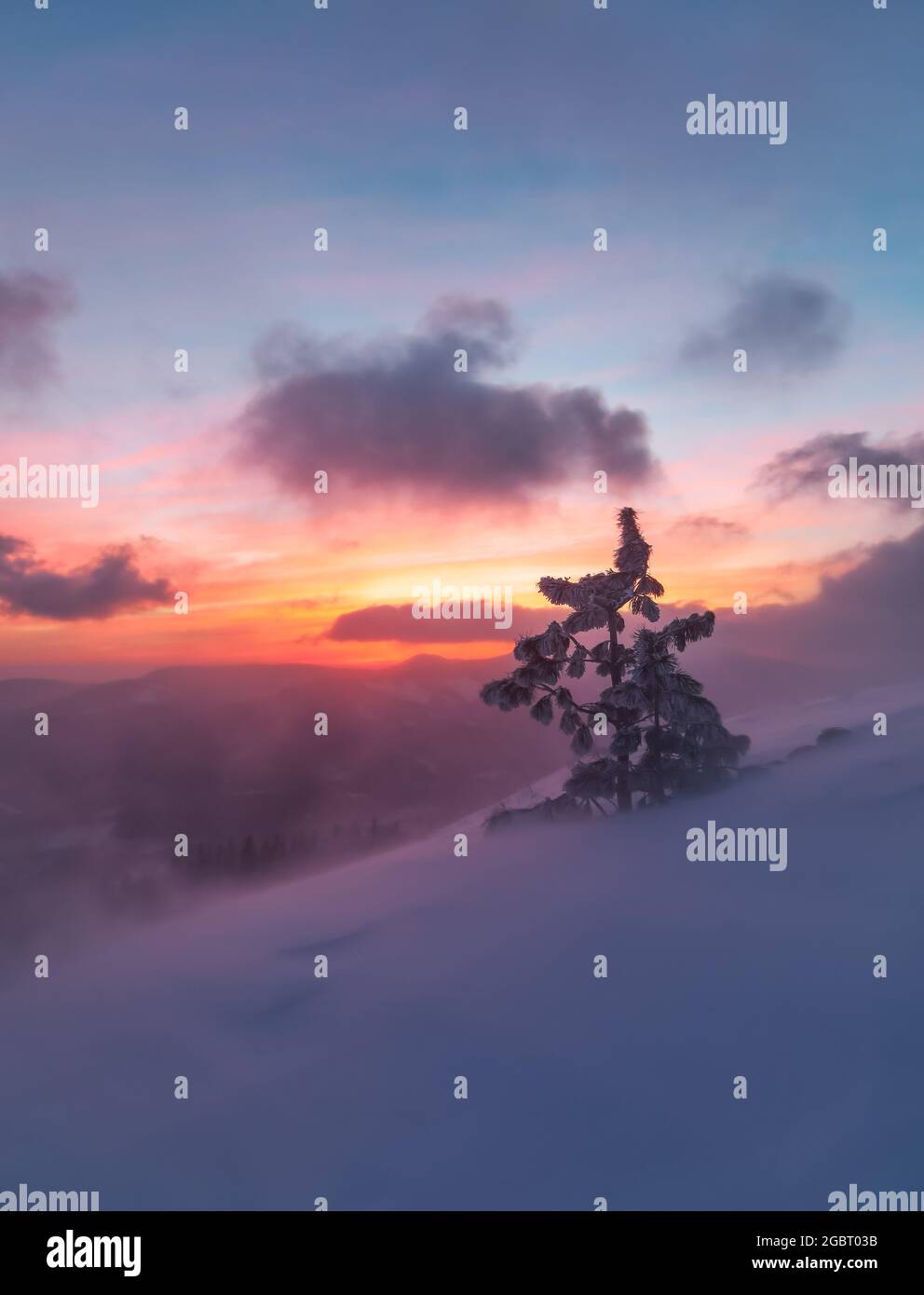 Winter. Aerial view. Amazing sunrise. High mountains with snow. A ...