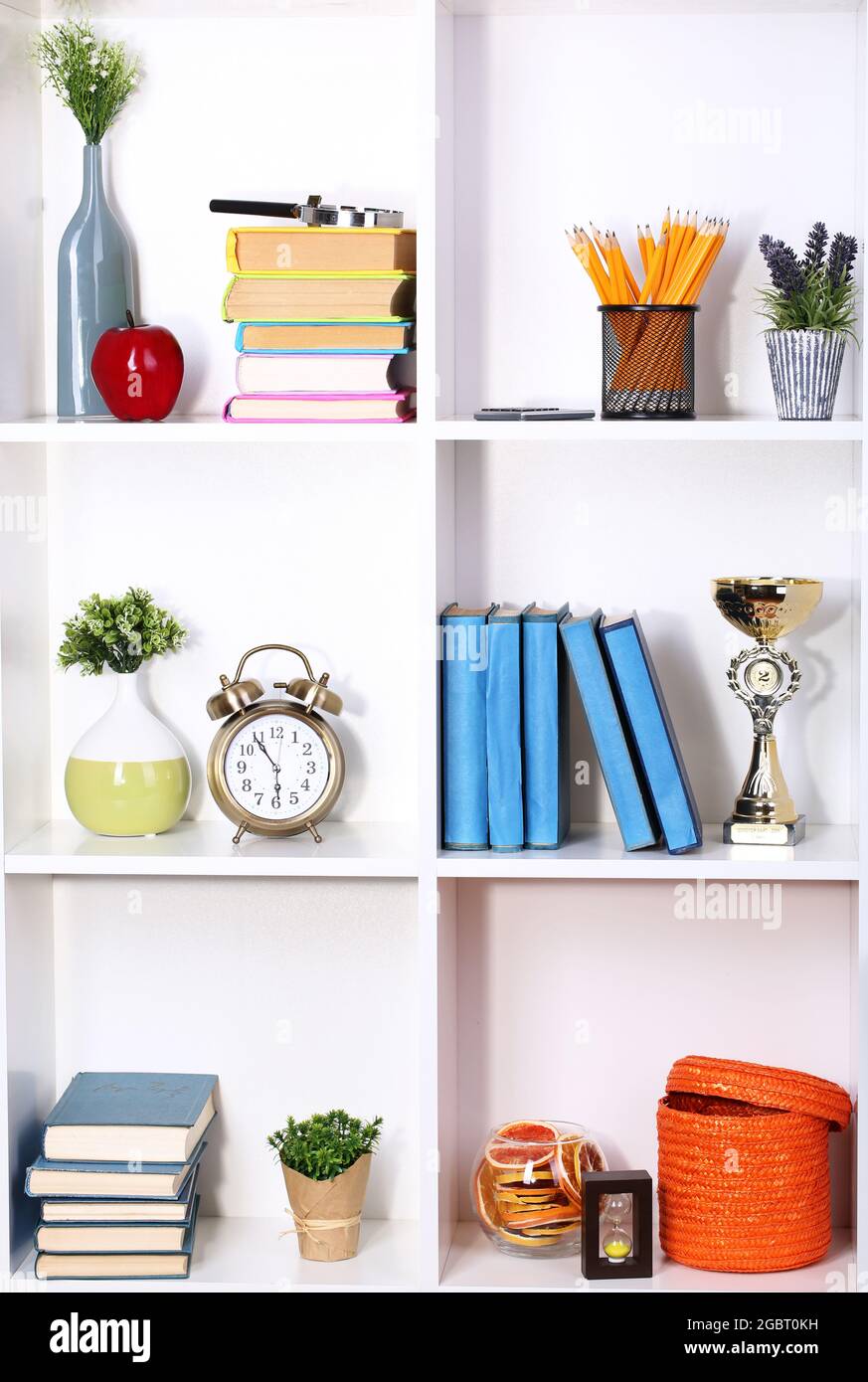 Beautiful white shelves with different home related objects Stock Photo ...