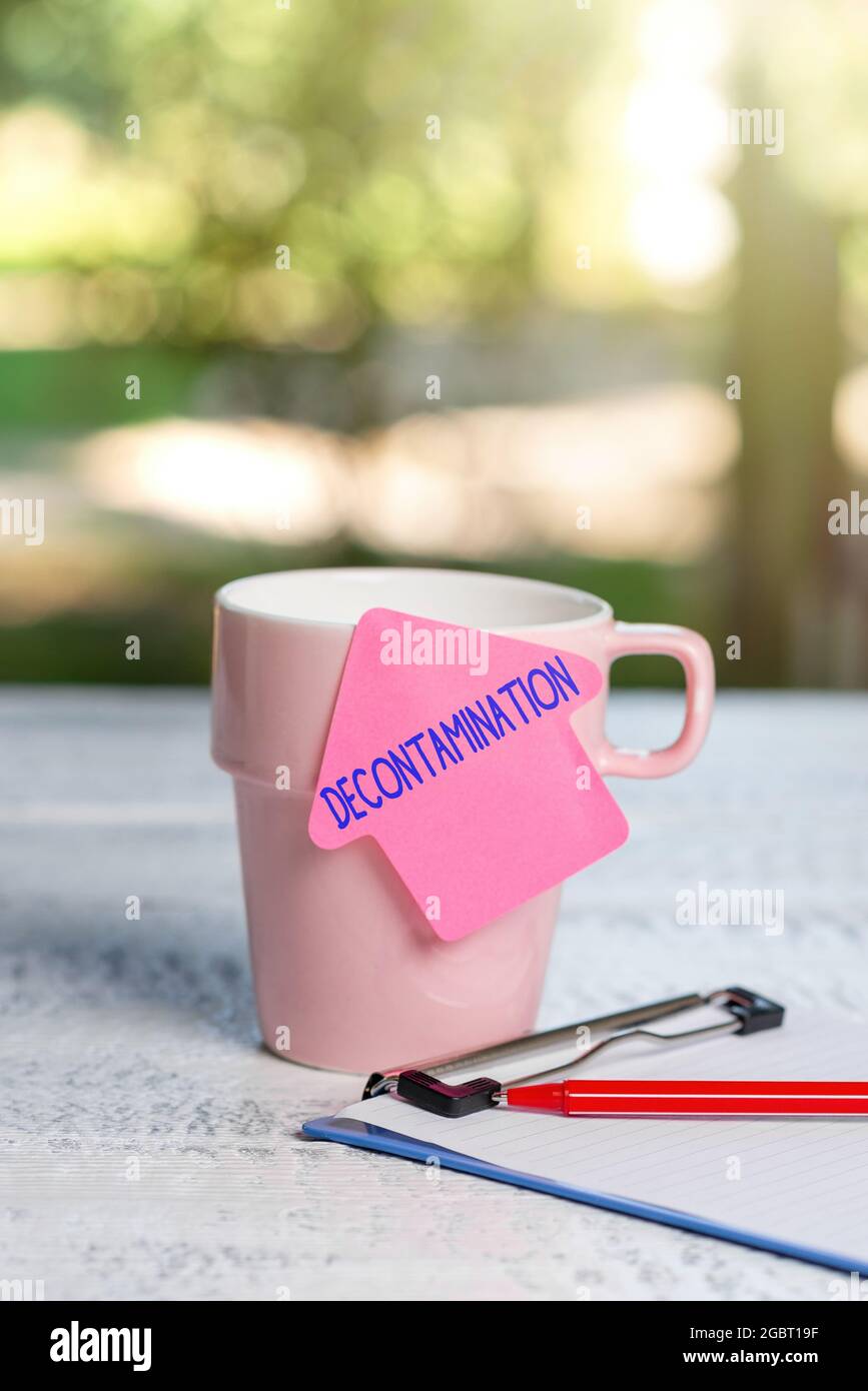 Hand writing sign Decontamination. Business idea neutralizing every ...