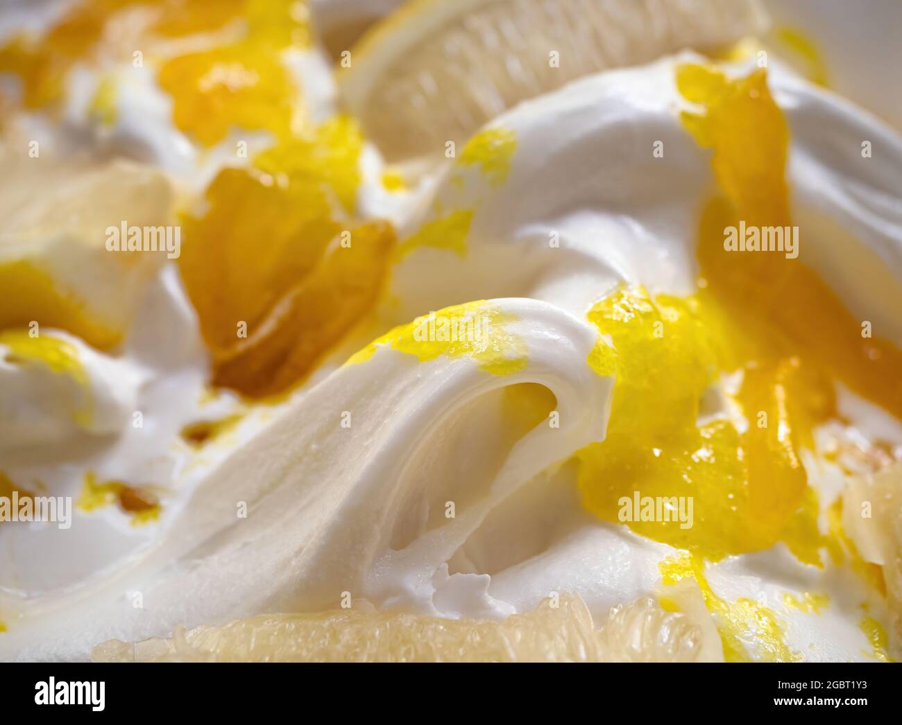 Frozen Lemon flavour gelato - full frame detail. Close up of a white ...