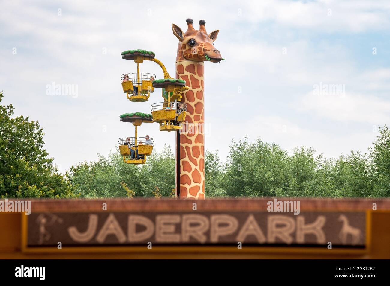 05 August 2021, Lower Saxony, Jaderberg: Visitors ride the "Giraffe ...