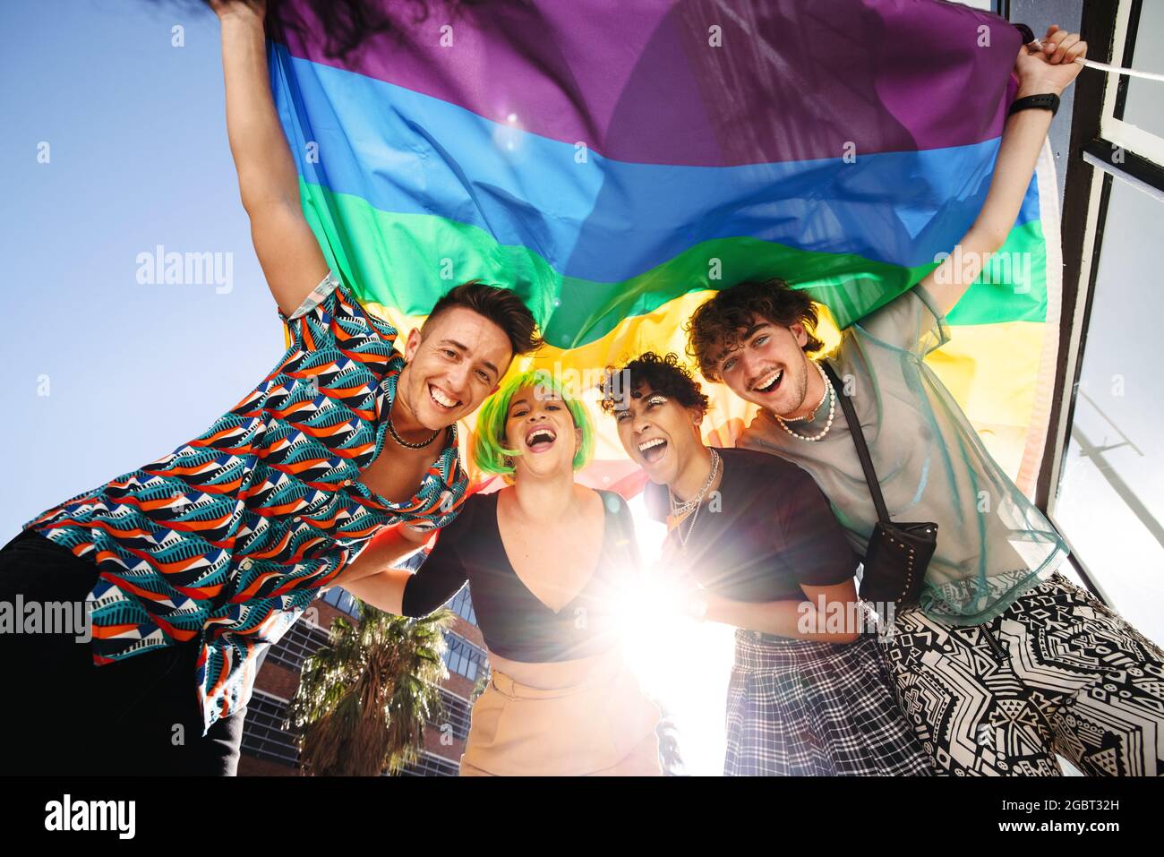 Cheerful young people celebrating their queer identities at a gay pride ...