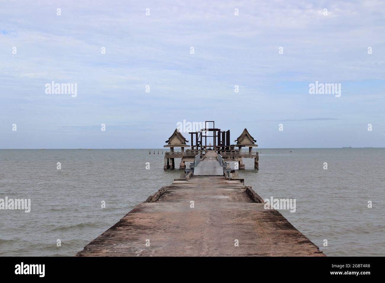A jetty or pier made of steel concrete, which leads to a deserted place ...